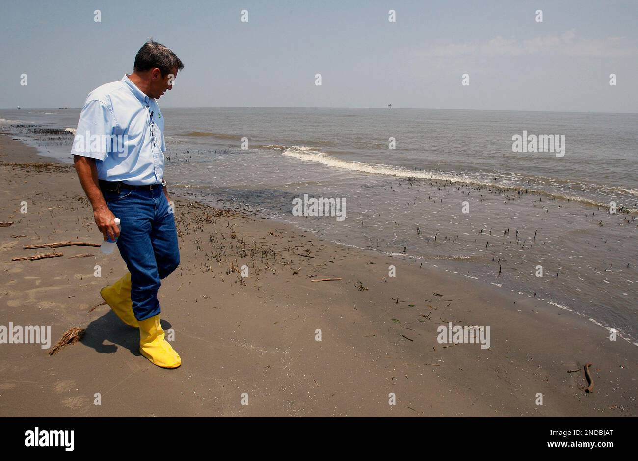 BP PLC COO of Exploration and Production Doug Suttles walks on a beach ...