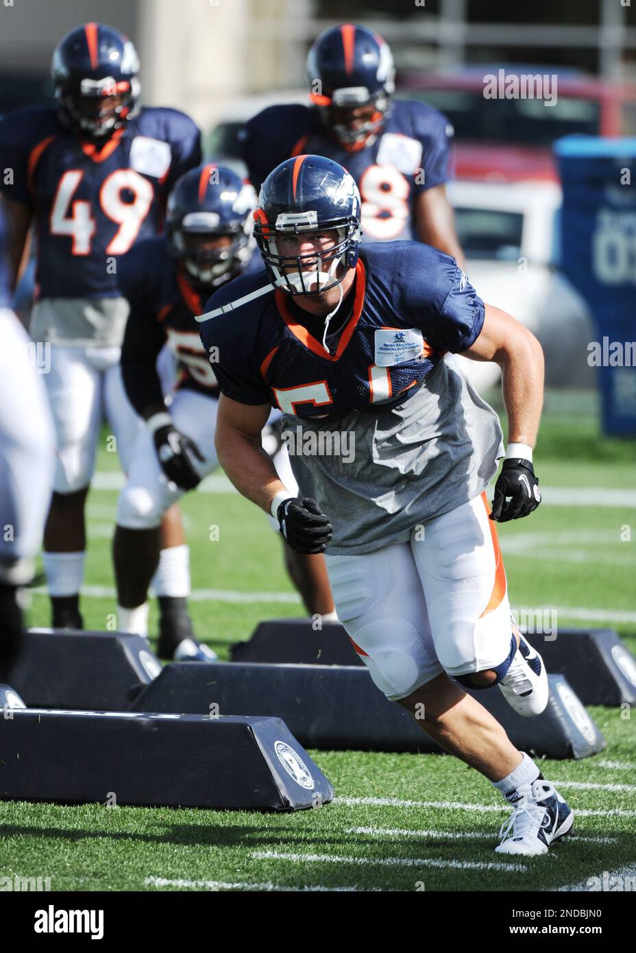 Denver Broncos linebacker Nick Greisen runs a drill during the morning ...