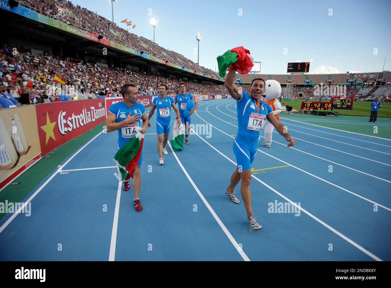 The Italian team celebrates their silver medal of the Men's 4x100 relay ...
