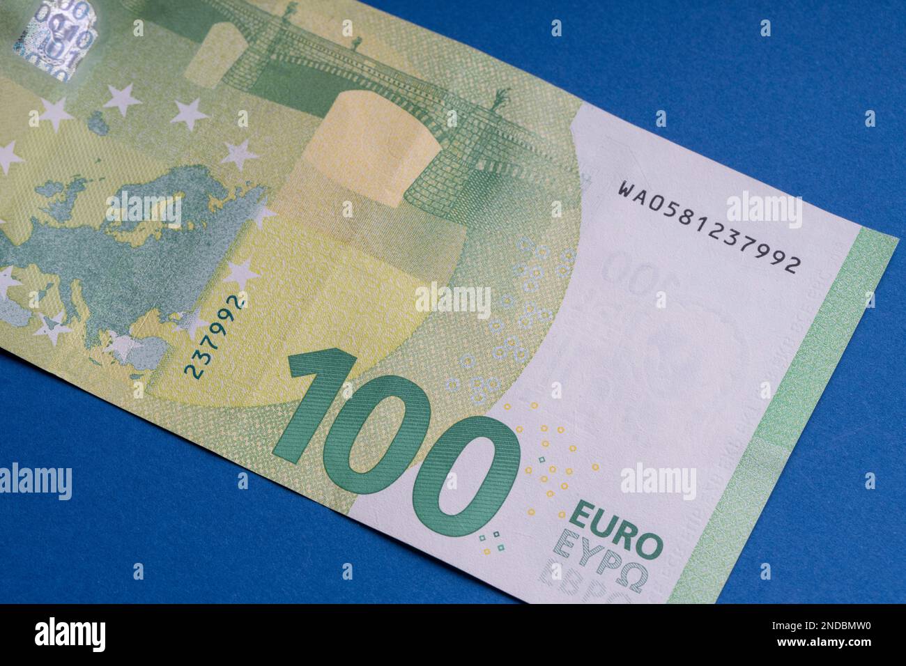 100 euro banknote close up, blue background for business finance topics ...