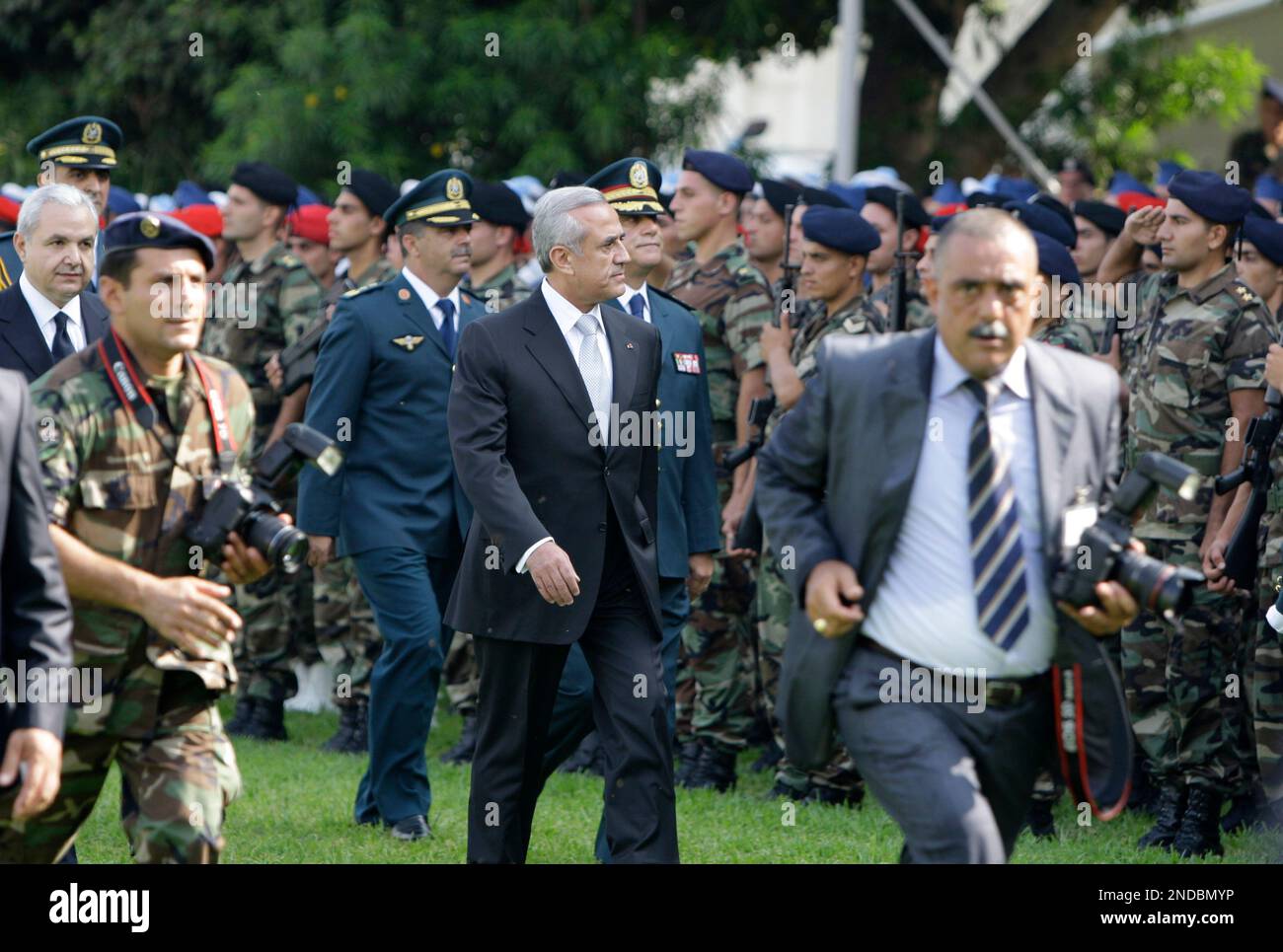 Lebanese President Michel Suleiman, center, arrives to attend a ...