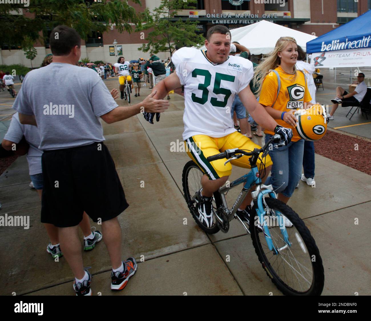 Green Bay Packers' Korey Hall rides a bike to NFL football training ...