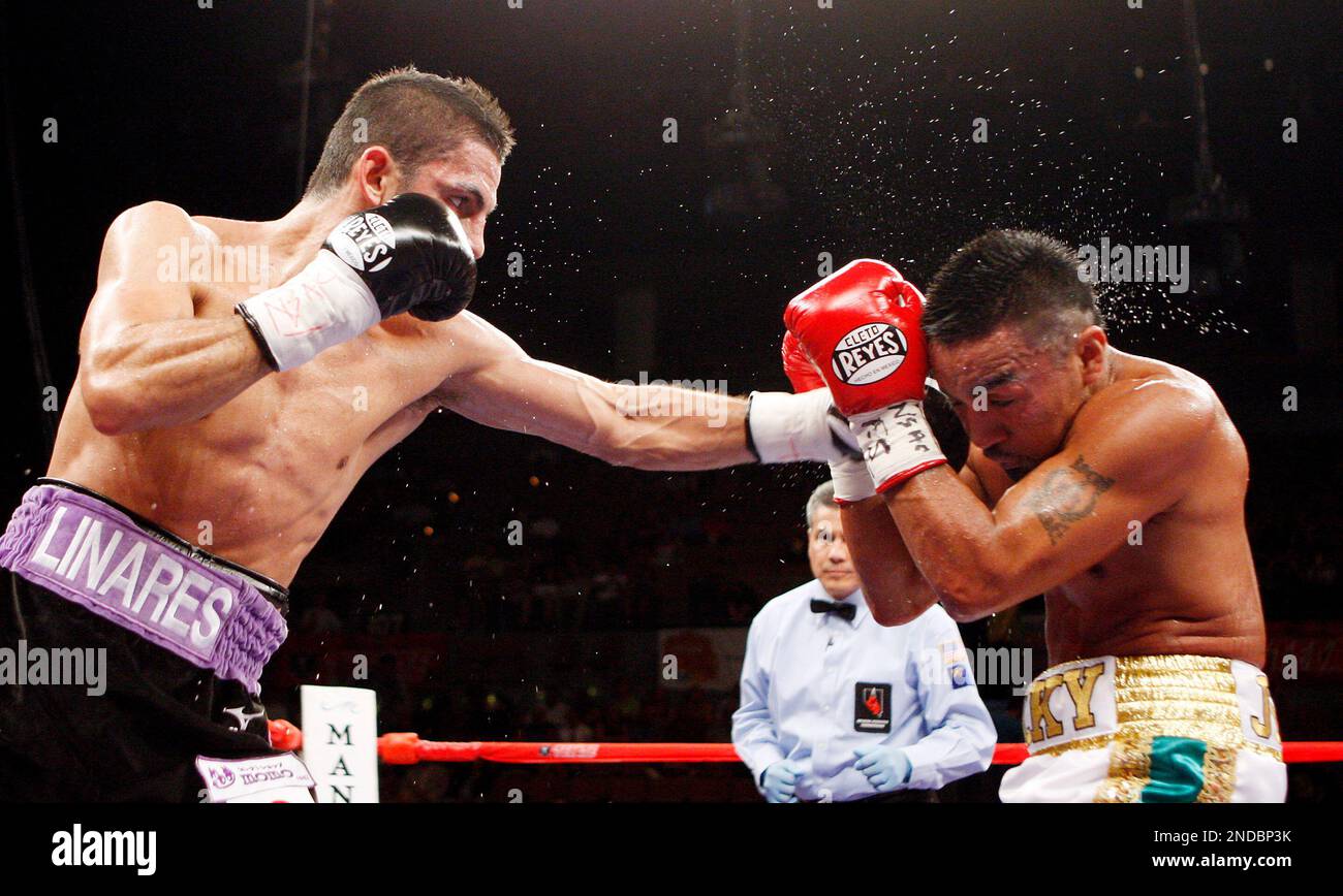 Jorge Linares, left, punches Rocky Juarez during their lightweight ...