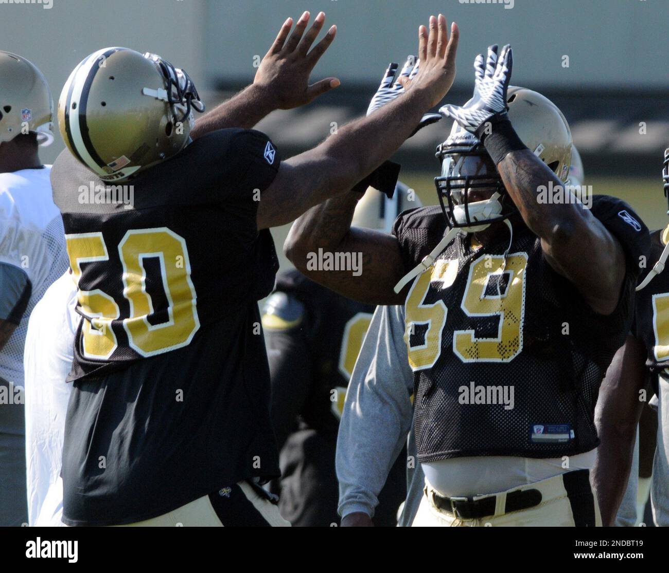 New Orleans Saints linebacker Marvin Mitchell, left, celebrates a play ...