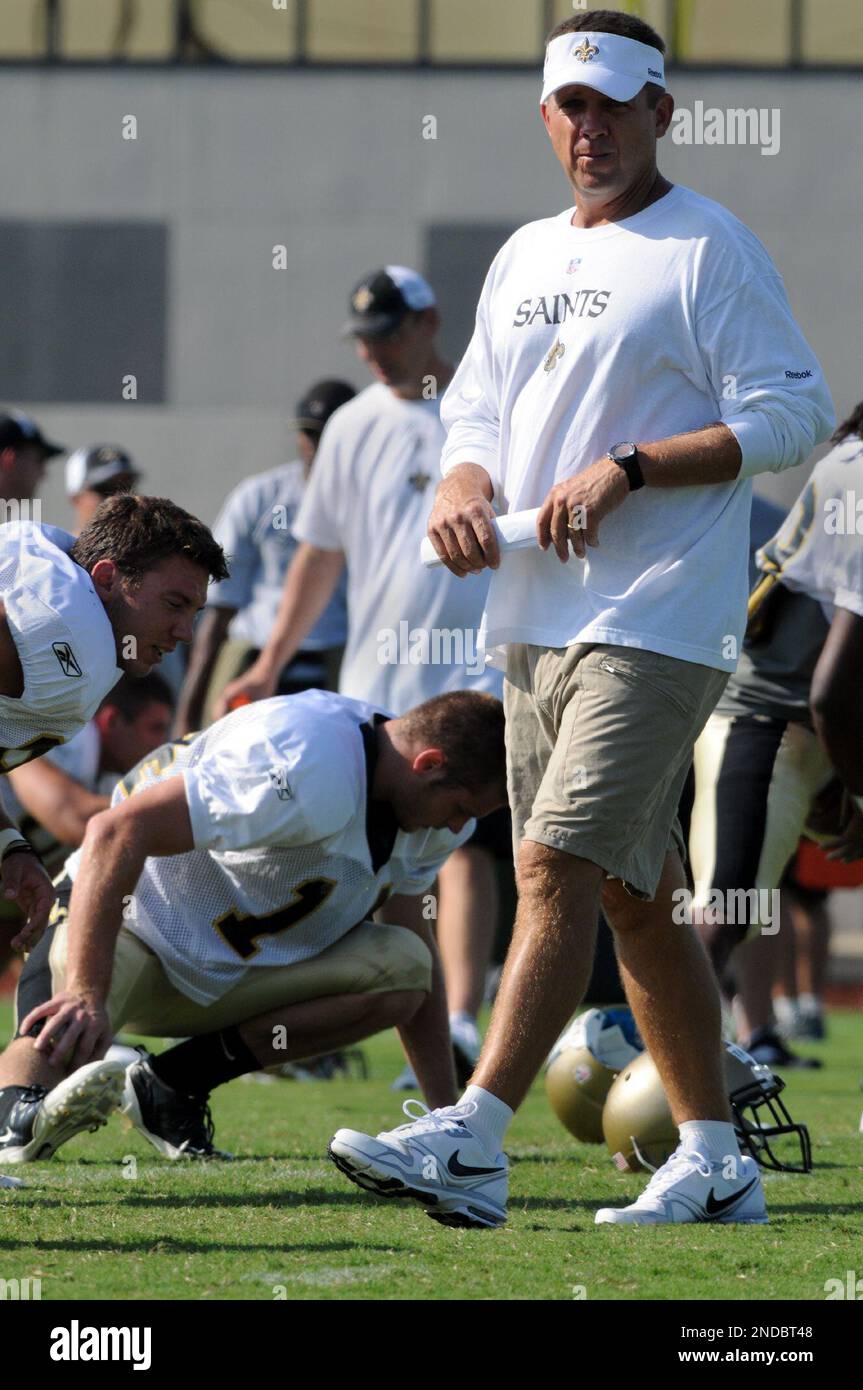 New Orleans Saints head coach Sean Payton watches the team stretch on ...