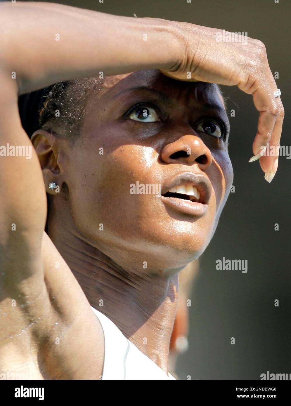 Jamaican-born Slovenia's Merlene Ottey looks at the scoreboard ...