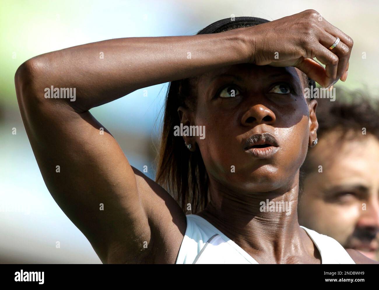 Jamaican-born Slovenia's Merlene Ottey looks at the scoreboard ...
