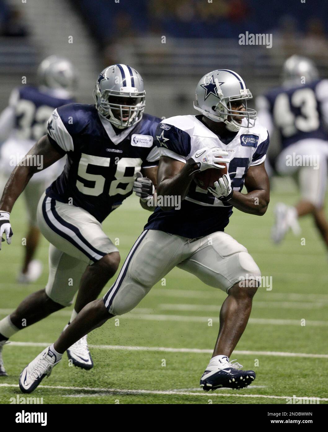 Dallas Cowboys linebacker Jason Williams (58) and running back Felix ...