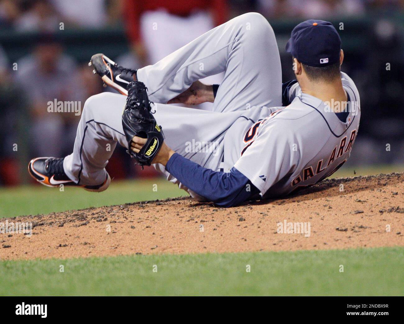 Detroit Tigers starting pitcher Armando Galarraga lands on the mound ...
