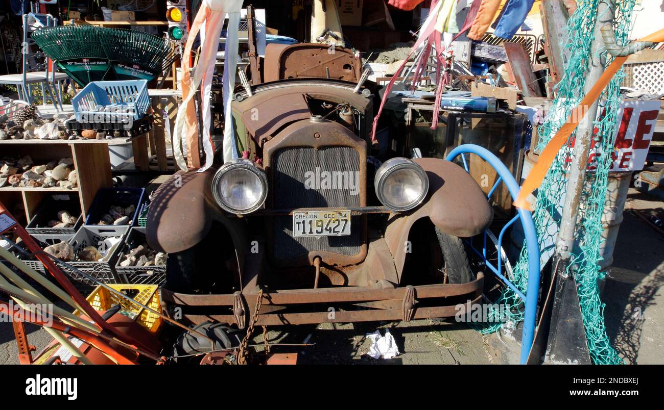 A 1928 Buick Sedan sits in the front yard of the Cooterville City Hall ...