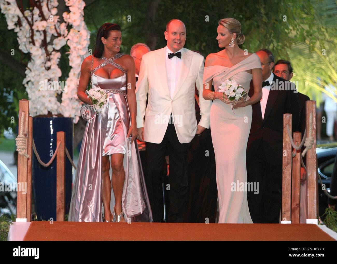 Prince Albert II of Monaco with his fiancee Charlene Wittstock, right ...