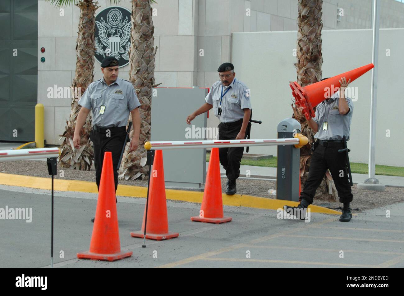 Security personal walk in front of the U.S. consulate in Ciudad Juarez ...