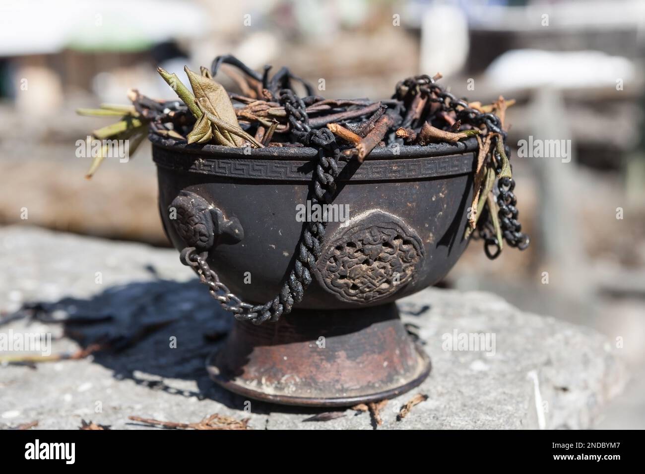 Nepalese traditional Buddhist ritual bowl with offerings to burn Stock ...