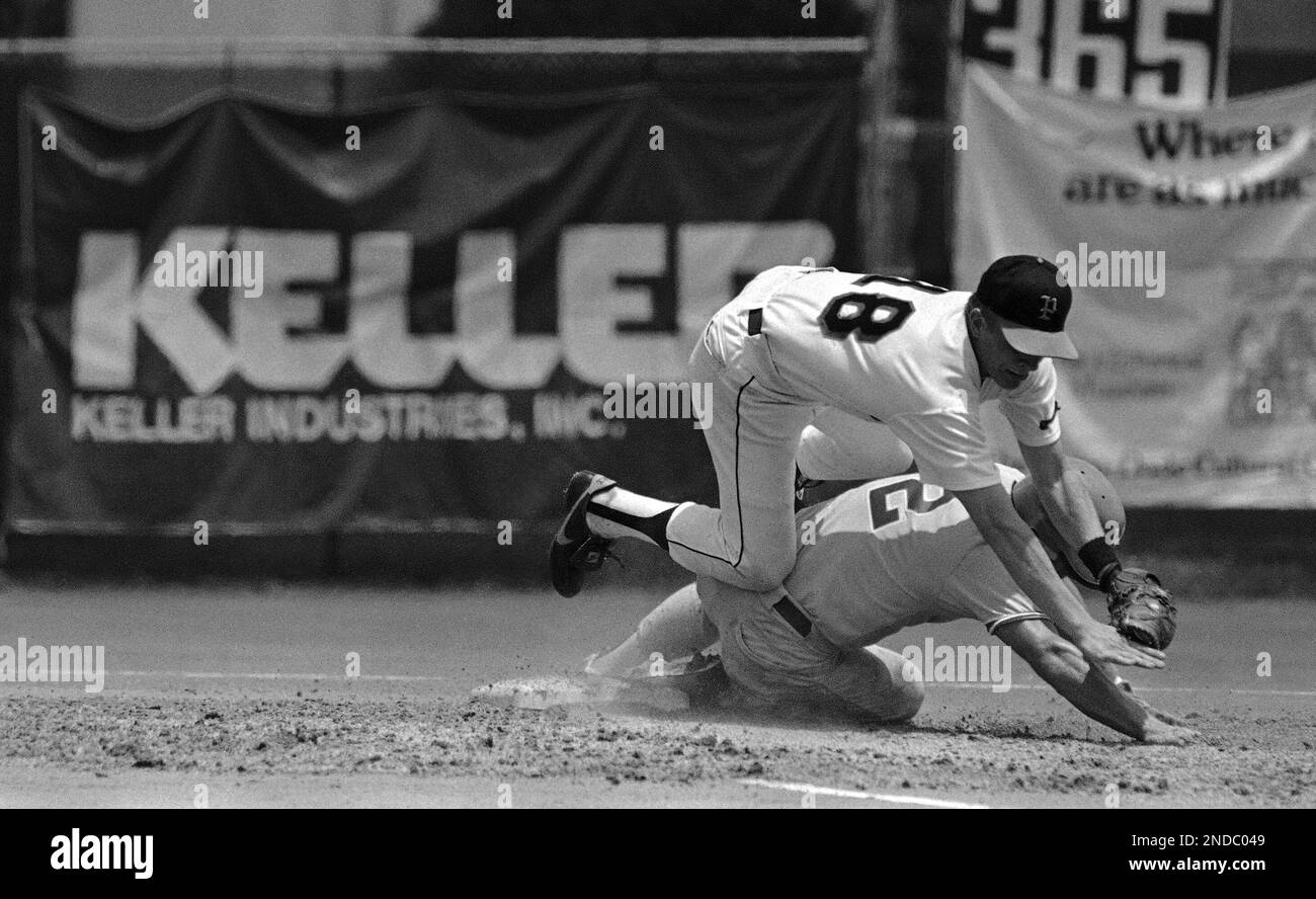 Princeton shortstop Todd Leavitt (18) falls over University of Florida ...