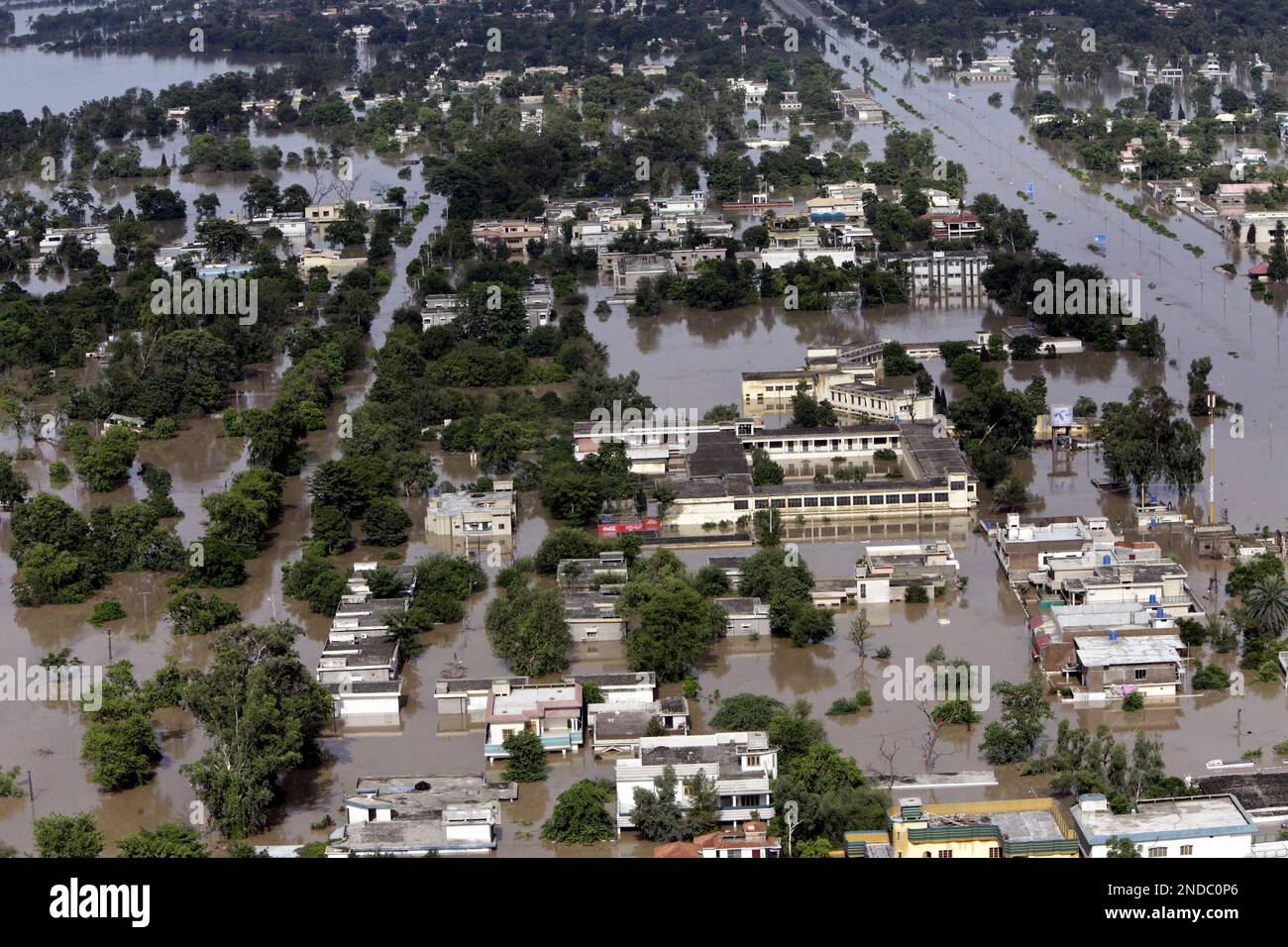 An aerial view shows Nowshera city submerged in floodwater caused by ...