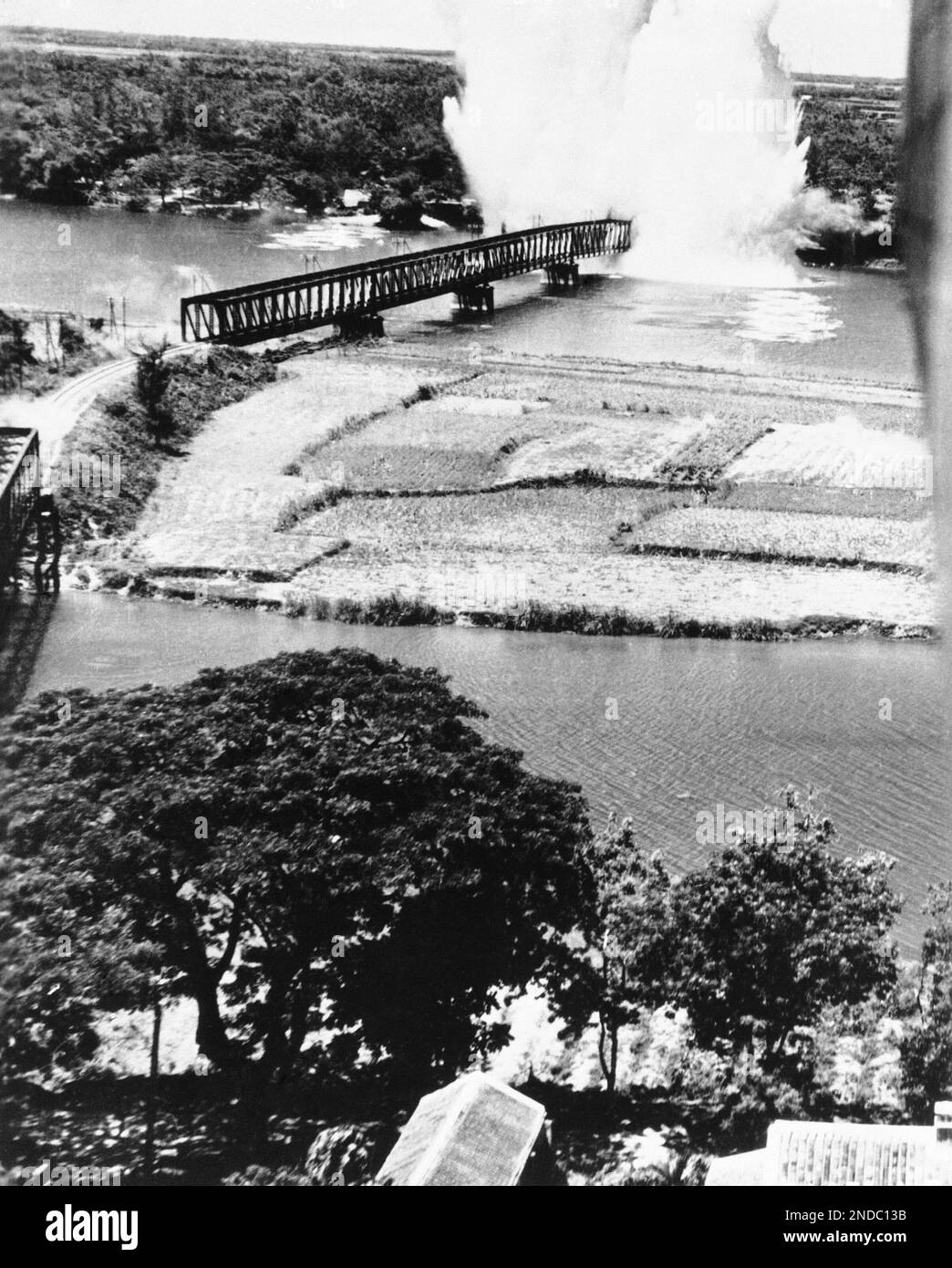 Bombs dropped by units of the U.S. Army 14th Air Force burst on the Dai ...