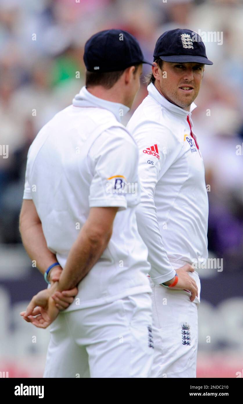 England's Graeme Swann, right, speaks to Andrew Strauss during the ...