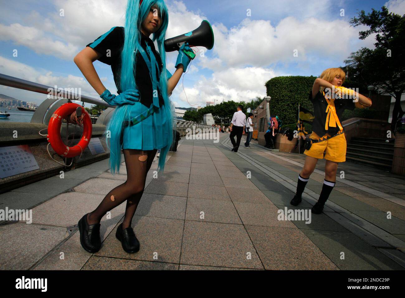 Participants dressed as Japanese animation characters, pose outside the ...