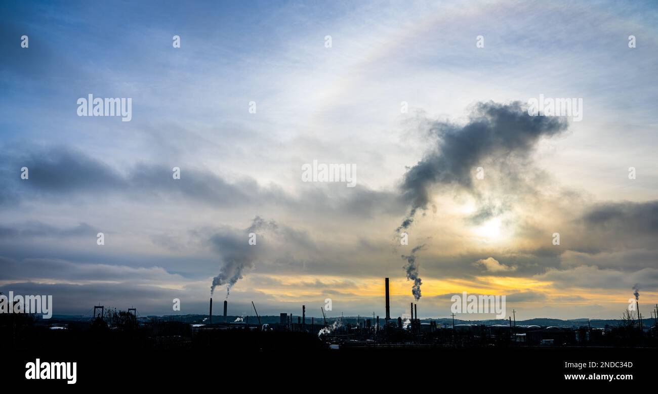 Oil and gas refinery under a light sky Stock Photo - Alamy