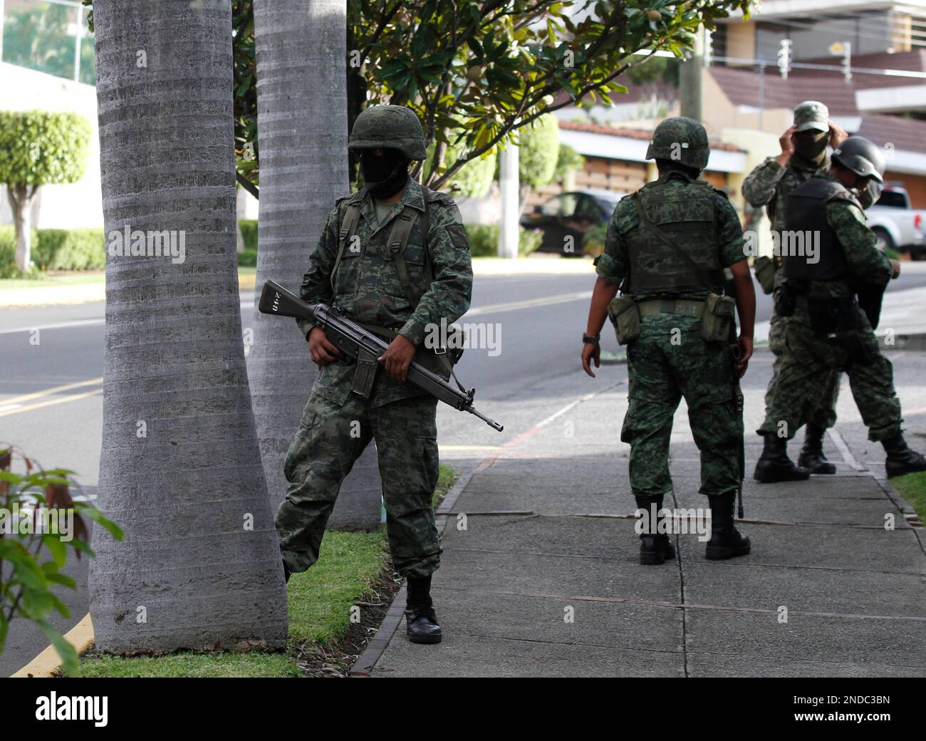 Soldiers guard a street in the area where Mexican drug cartel leader ...