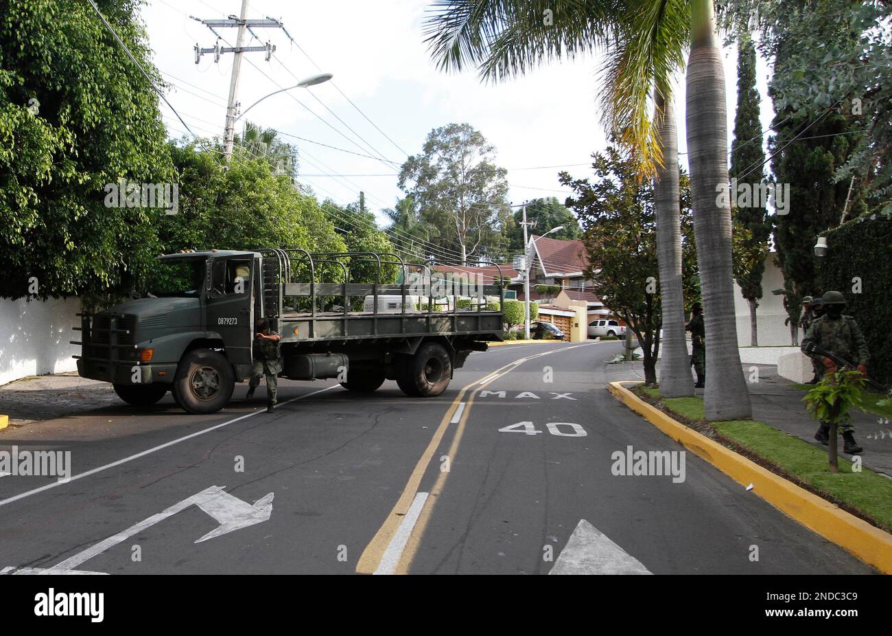 Soldiers guard a street in the area where Mexican drug cartel leader ...