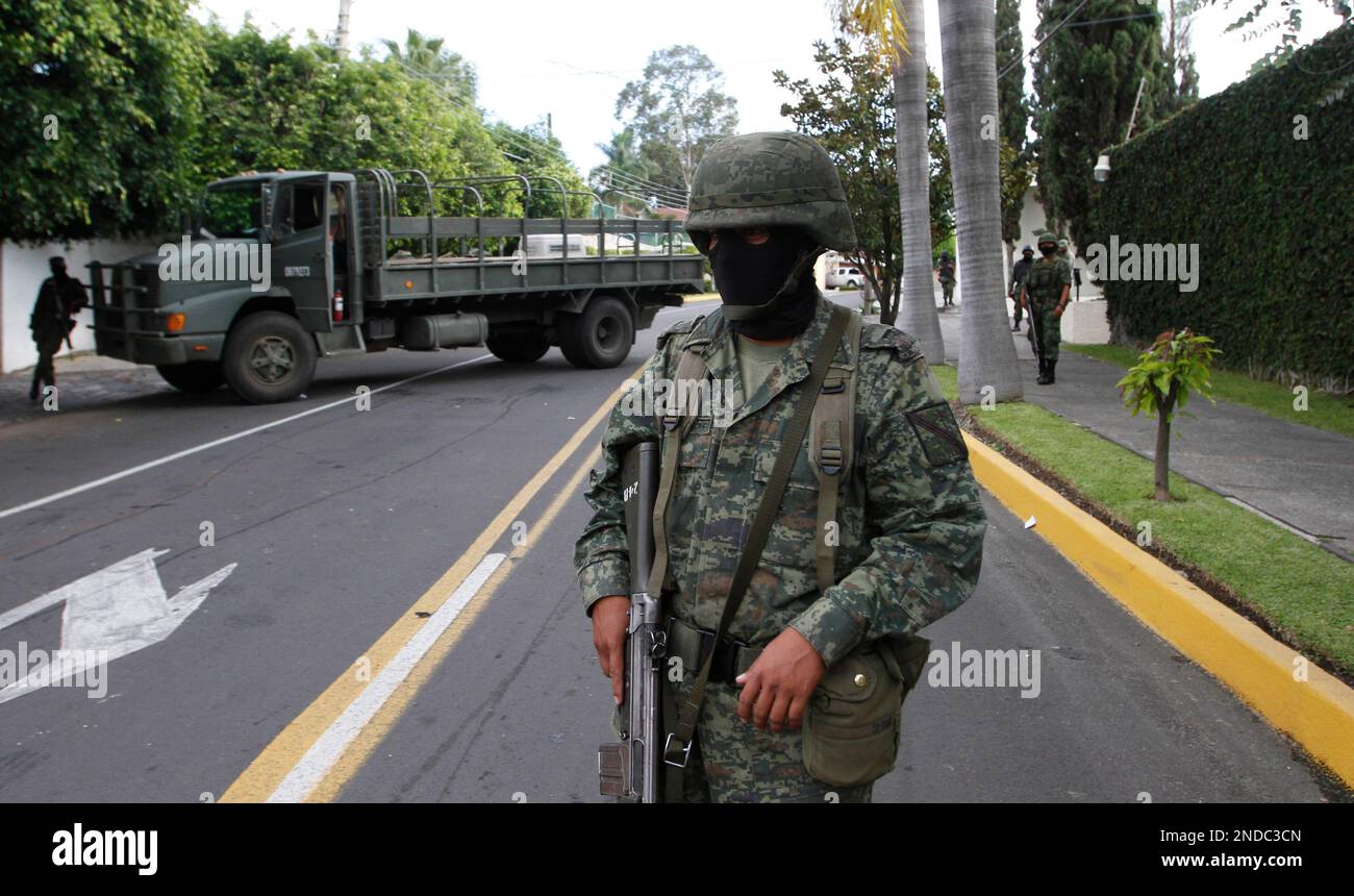 Soldiers guard a street in the area where Mexican drug cartel leader ...