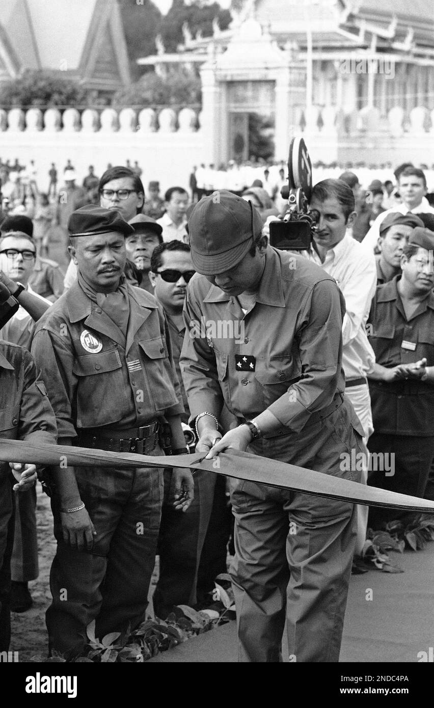 Cambodian Prime Minister Lt. General Lon Nol, right, cuts the tape ...