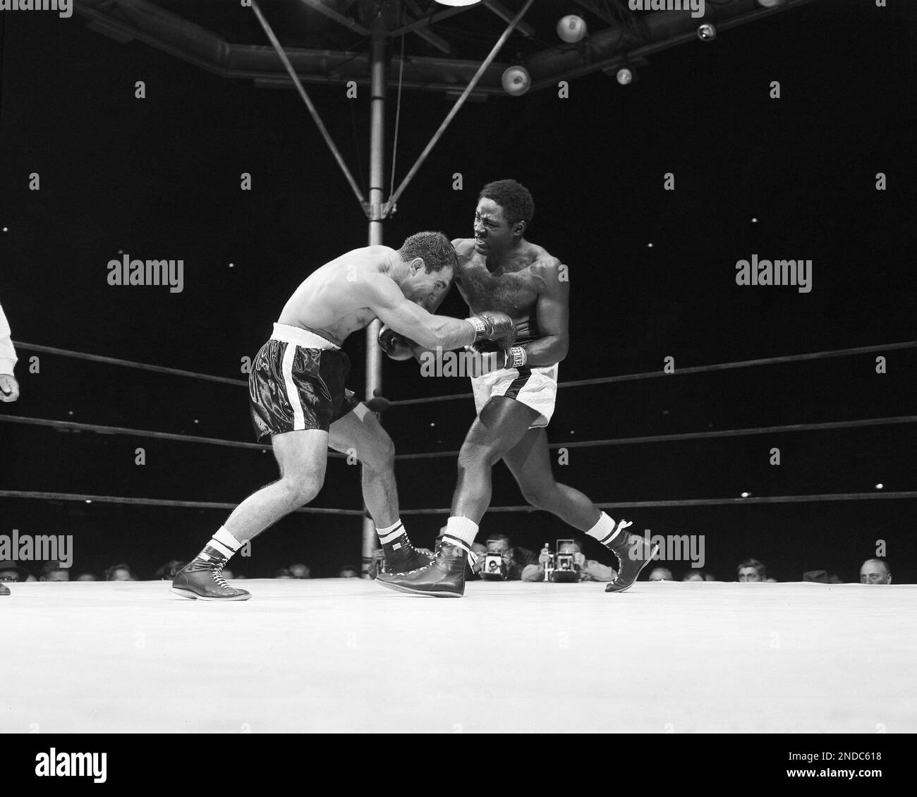 Rocky Marciano and Ezzard Charles fight at Yankee Stadium in New York ...