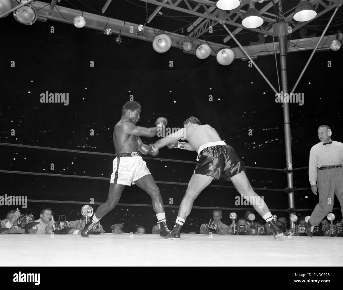 First round action in Rocky Marciano and Ezzard Charles fight at Yankee ...
