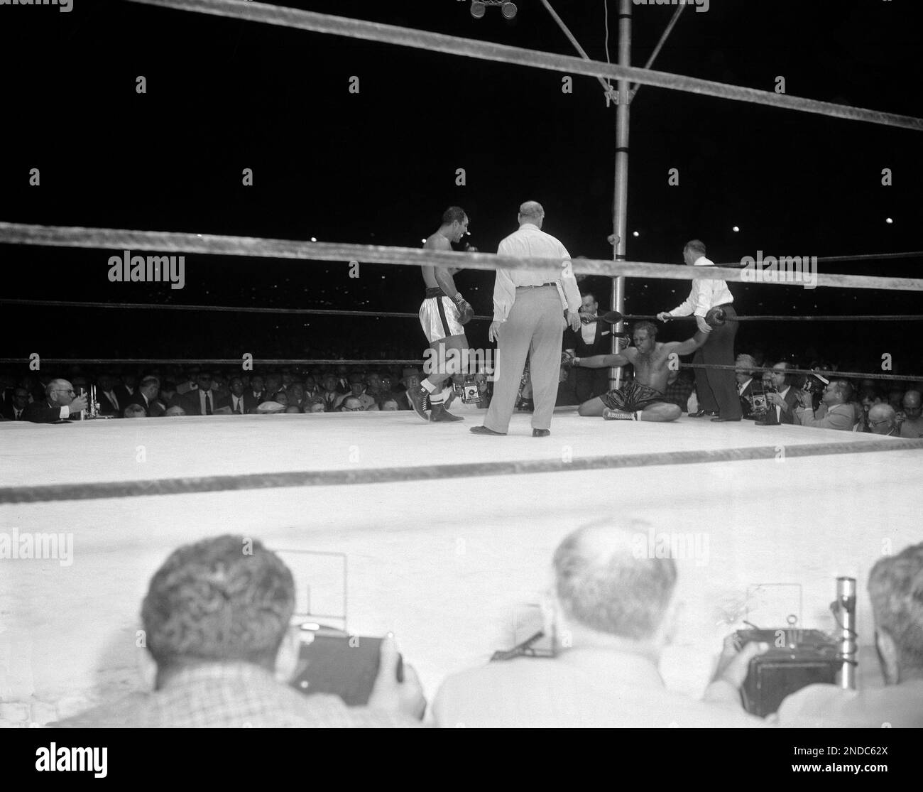 Challenger Archie Moore is down for the final time after being dropped ...