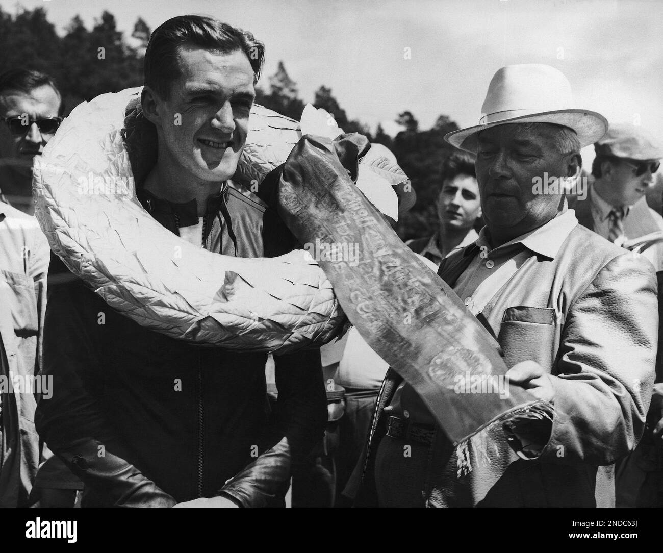 Ray Amm, Rhodesia, is decorated with the winner's wreath after he ...