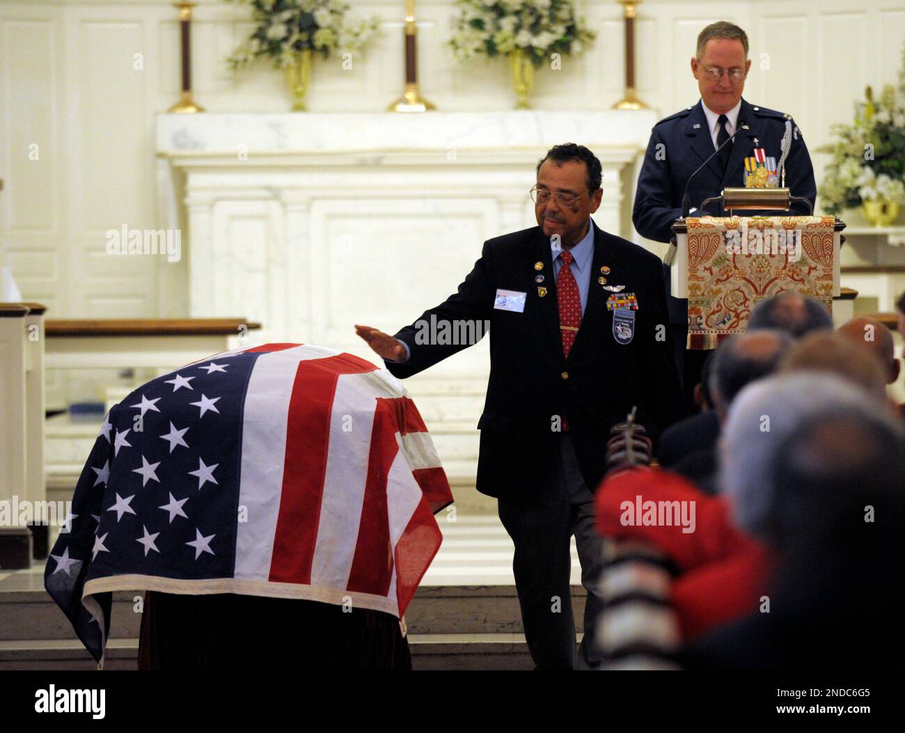 Retired Tuskegee Airman William Wheeler touches the casket of Lt. Col ...