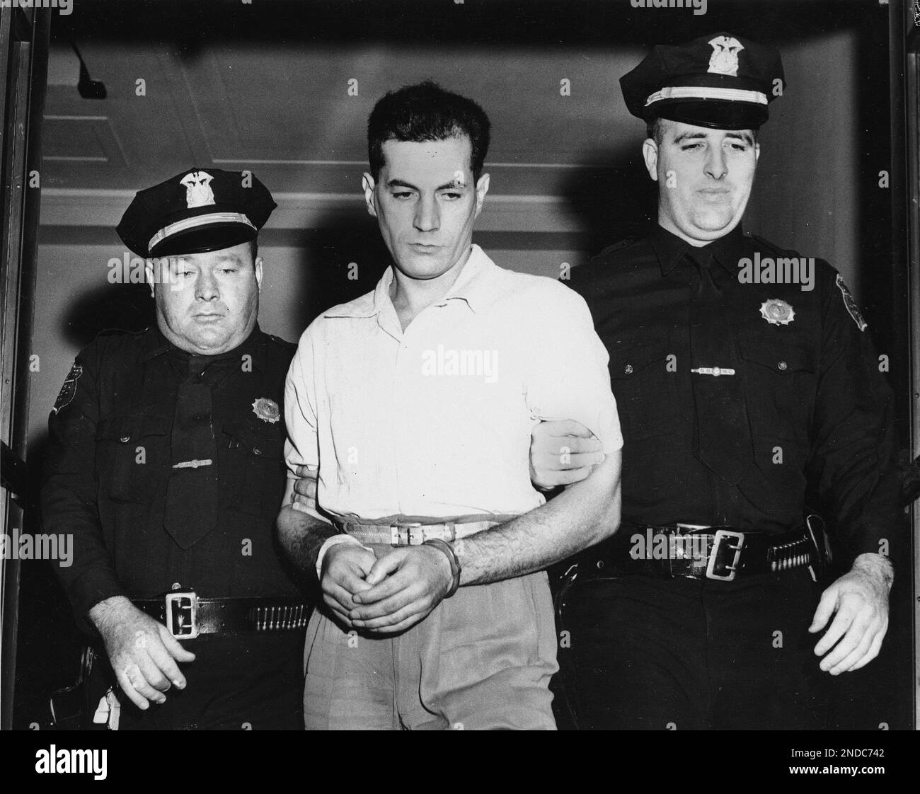 Angelo John LaMarca is escorted by unidentified deputy sheriffs from ...