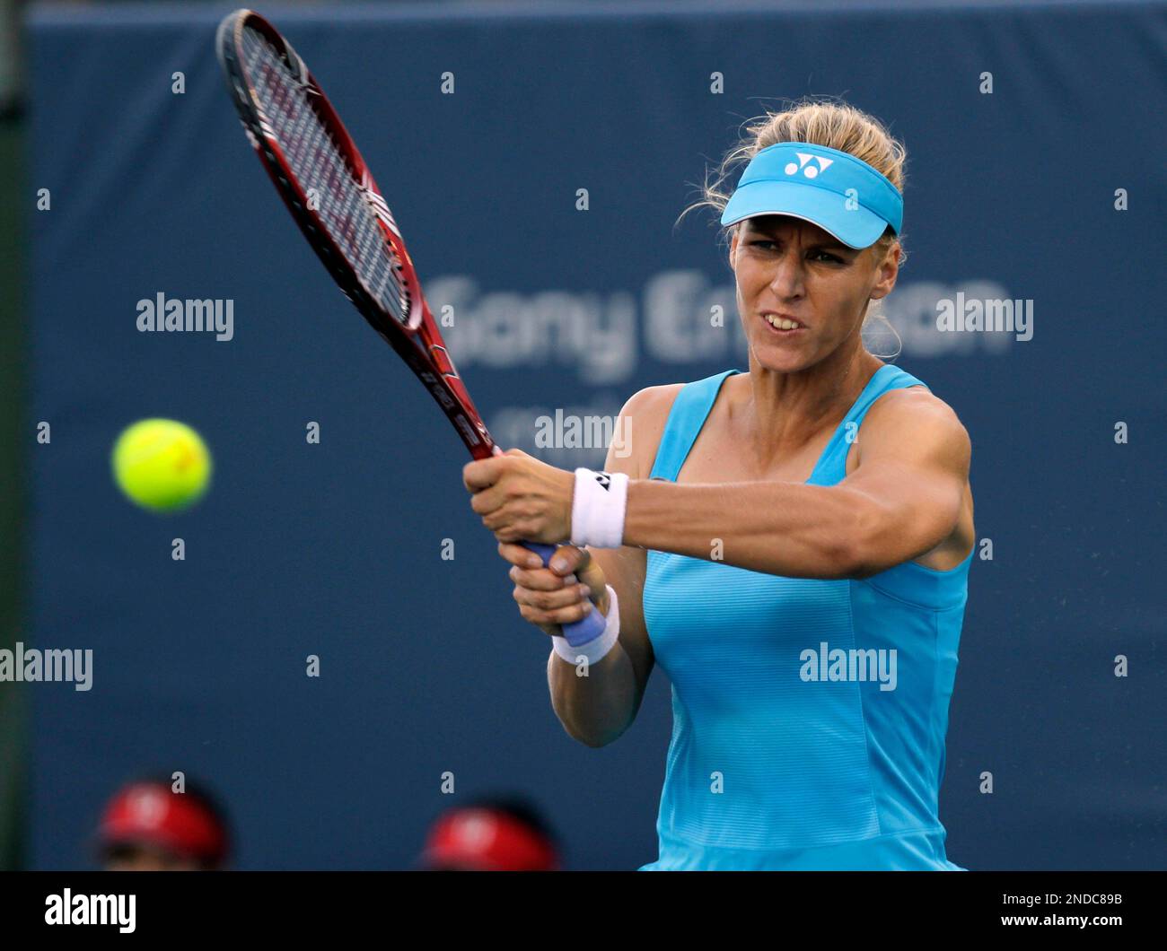 Elena Dementieva, of Russia, returns to Kimiko Date Krumm, of Japan ...