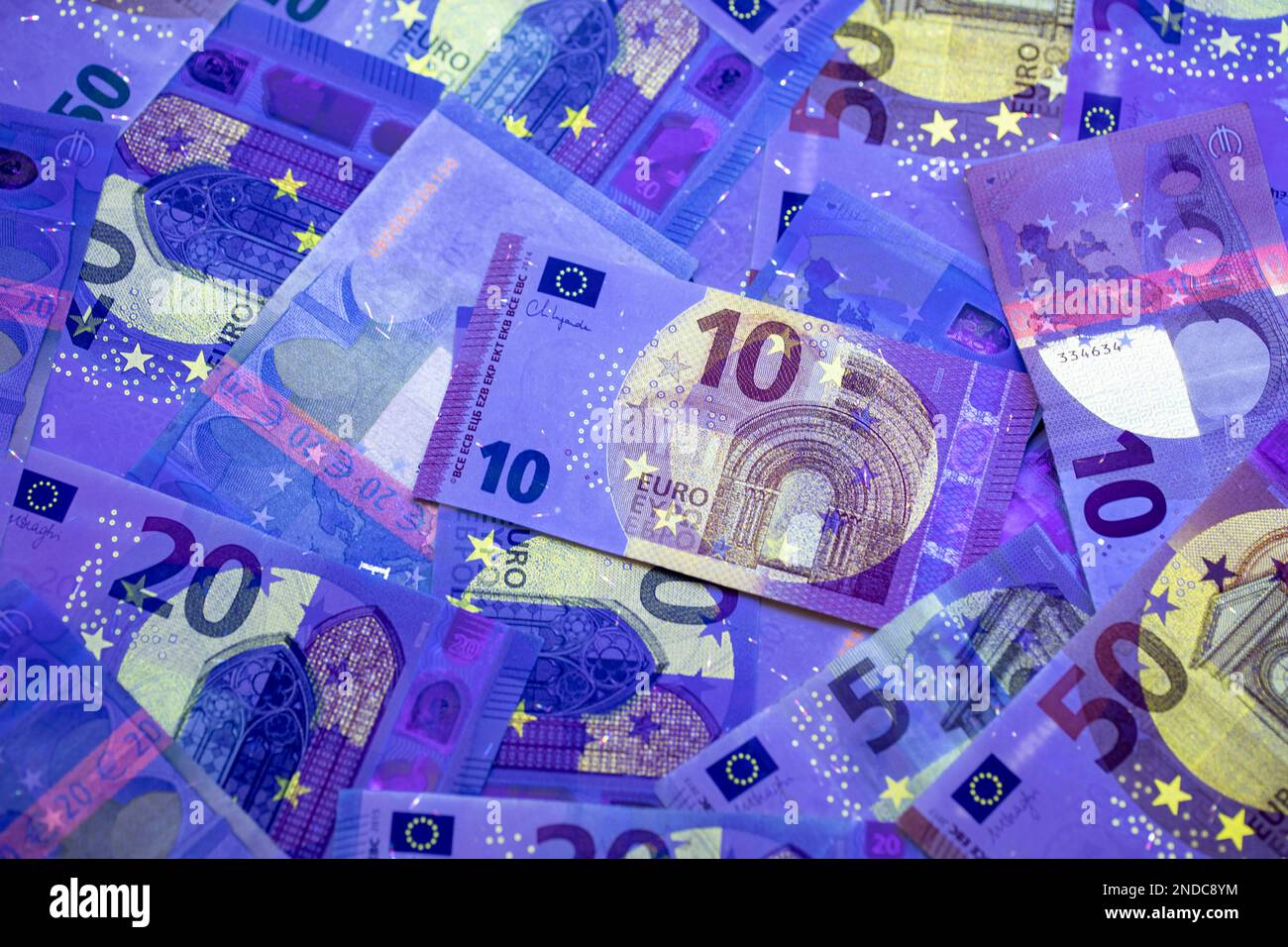 Euro currency in UV light protection. Euro in UV light to check the ...