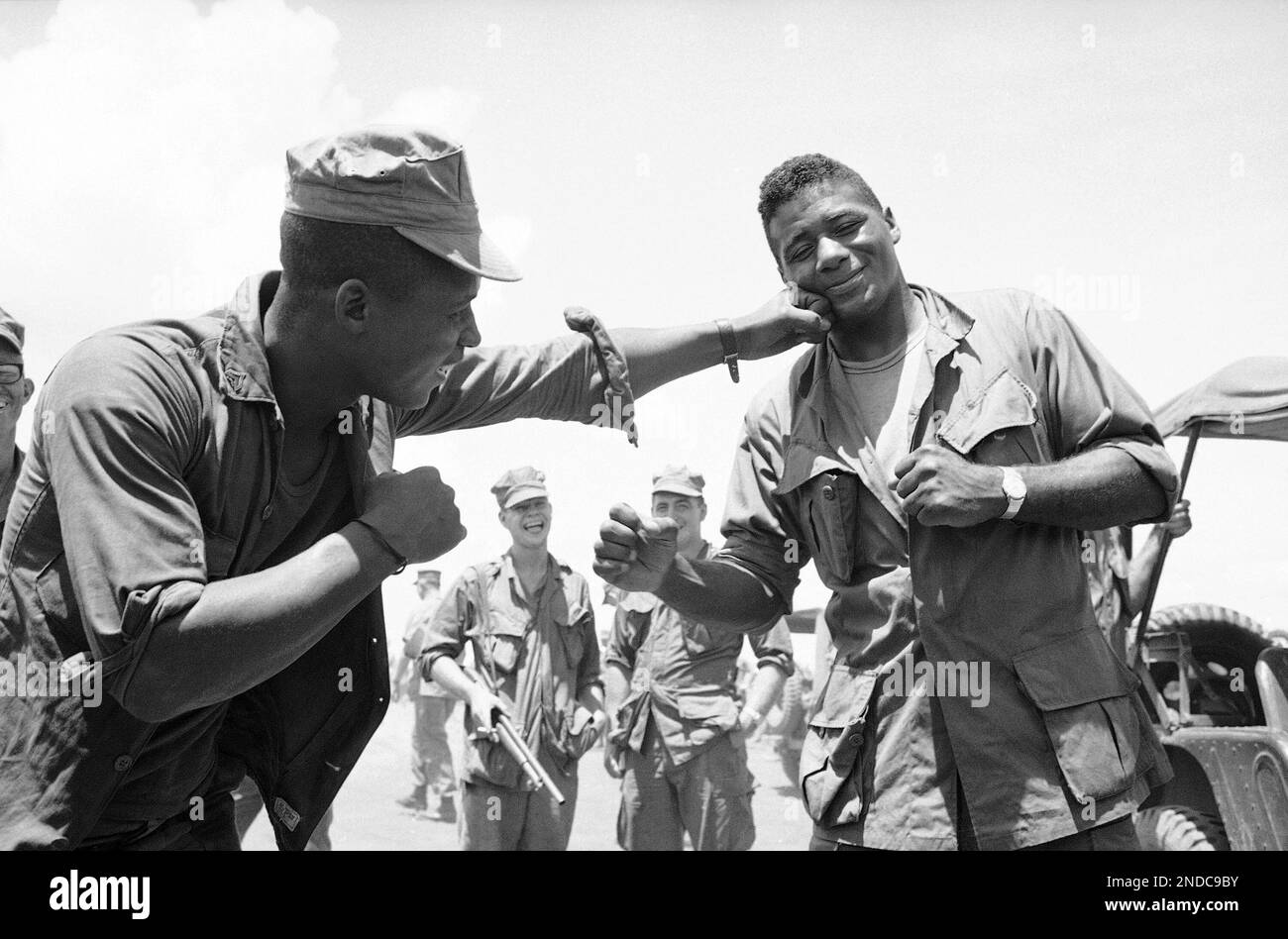 Members of the 1st Battalion, 26th marines, crowd around as one of ...