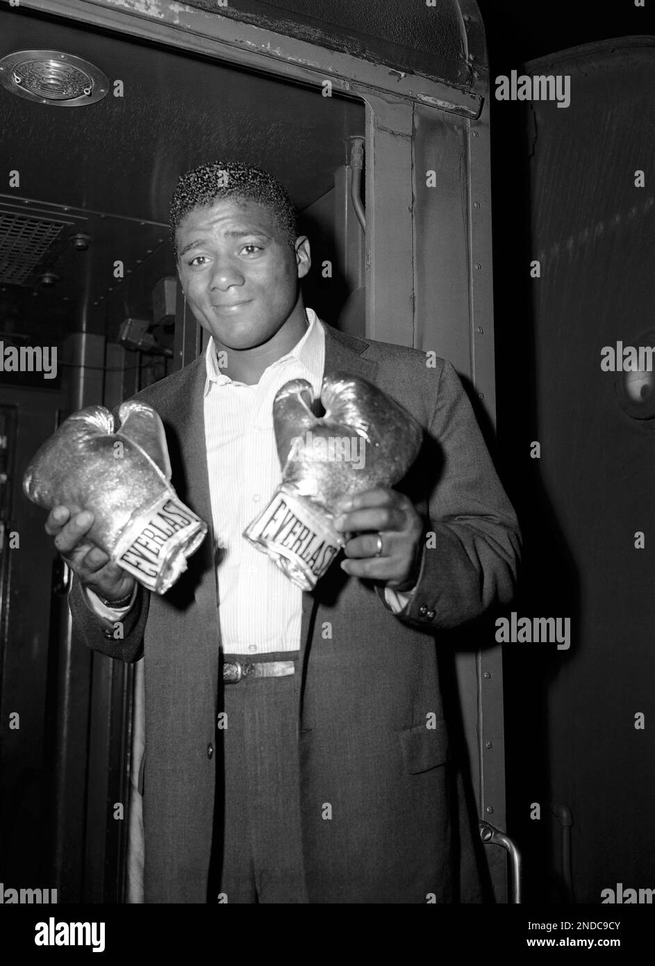 Heavyweight boxing champion Floyd Patterson holds a pair of Gilded ...