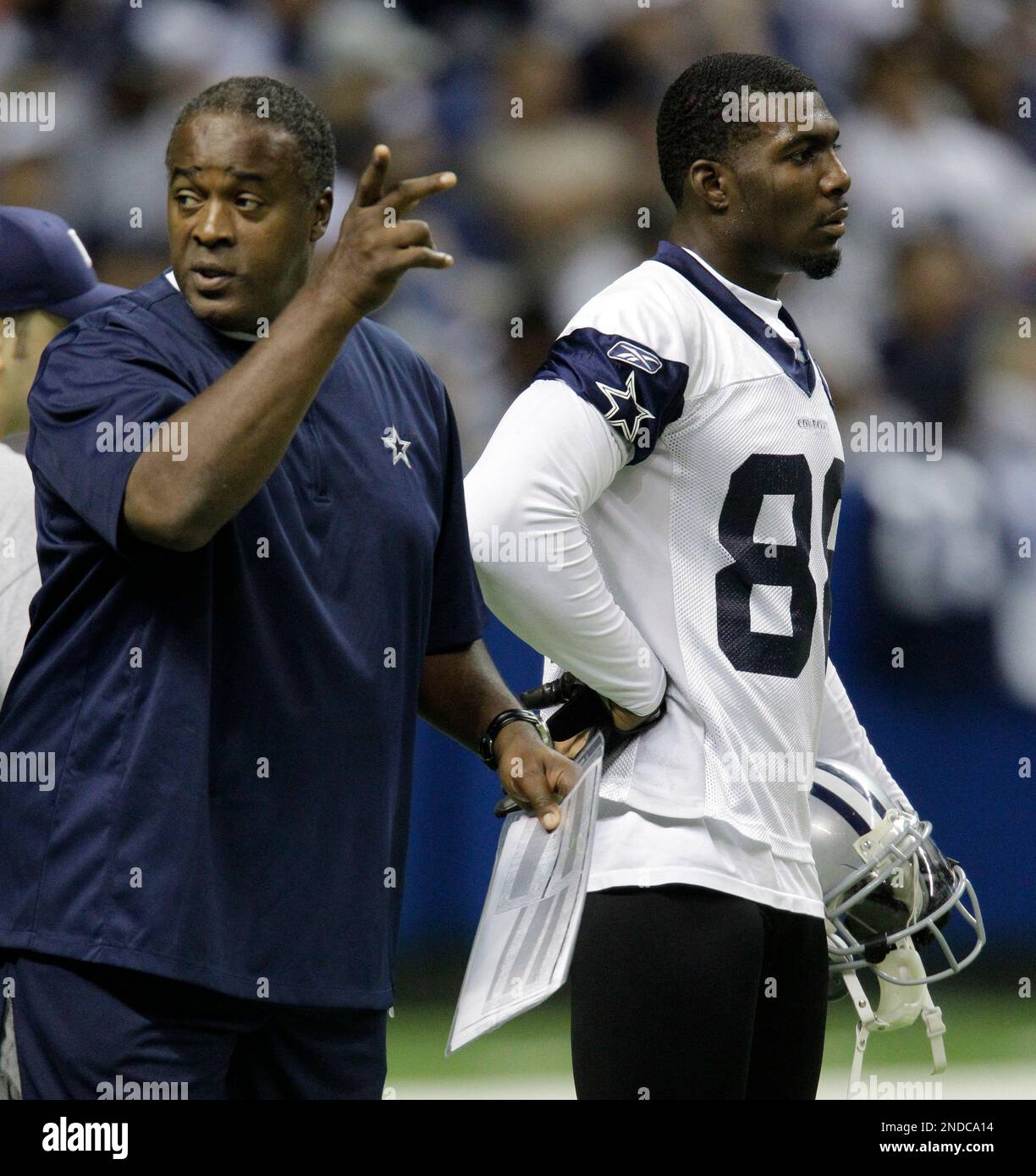 Dallas Cowboys wide receivers coach Ray Sherman, left, gives ...