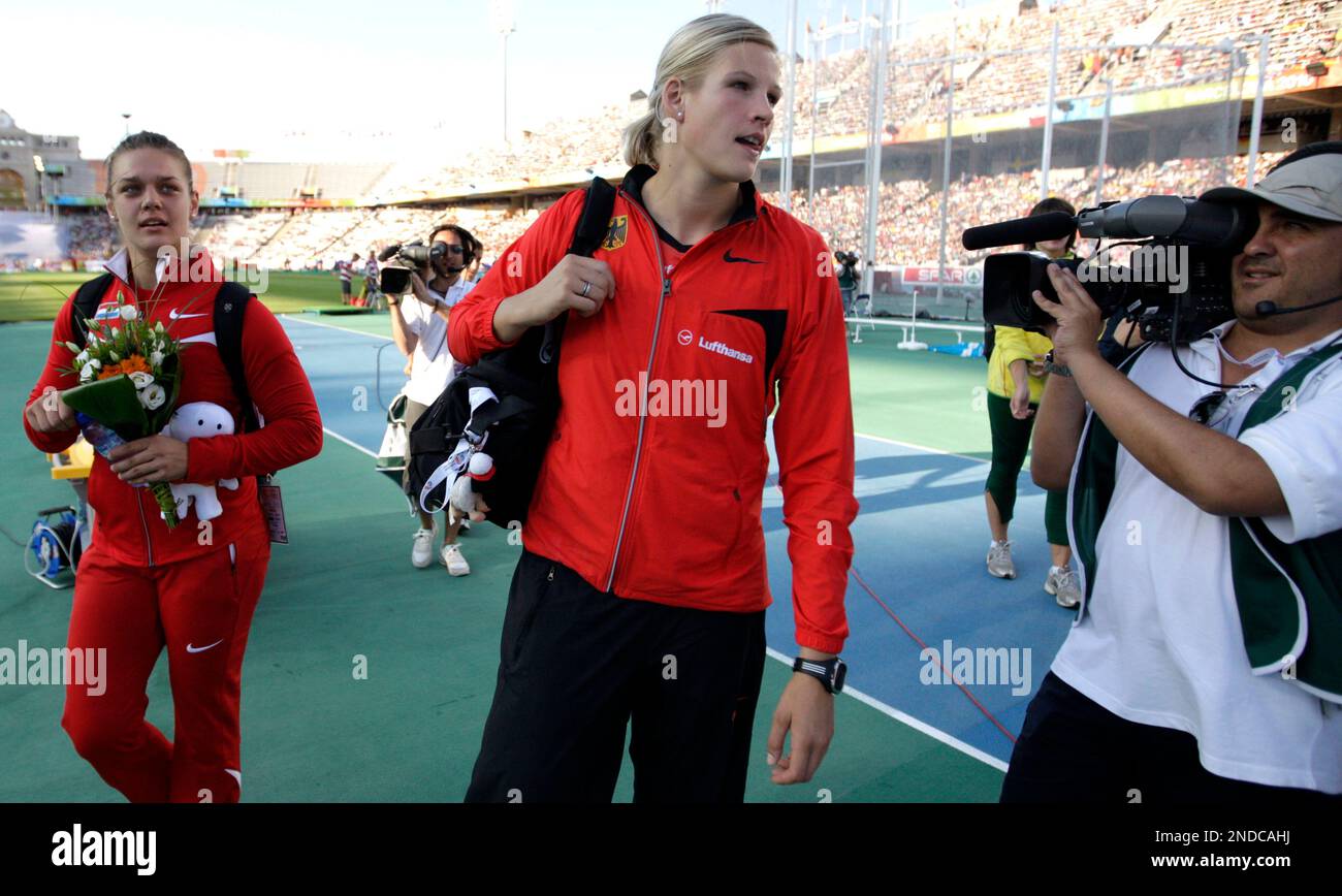Germany's Nadine Muller, center, walks off the infield after Croatia's ...
