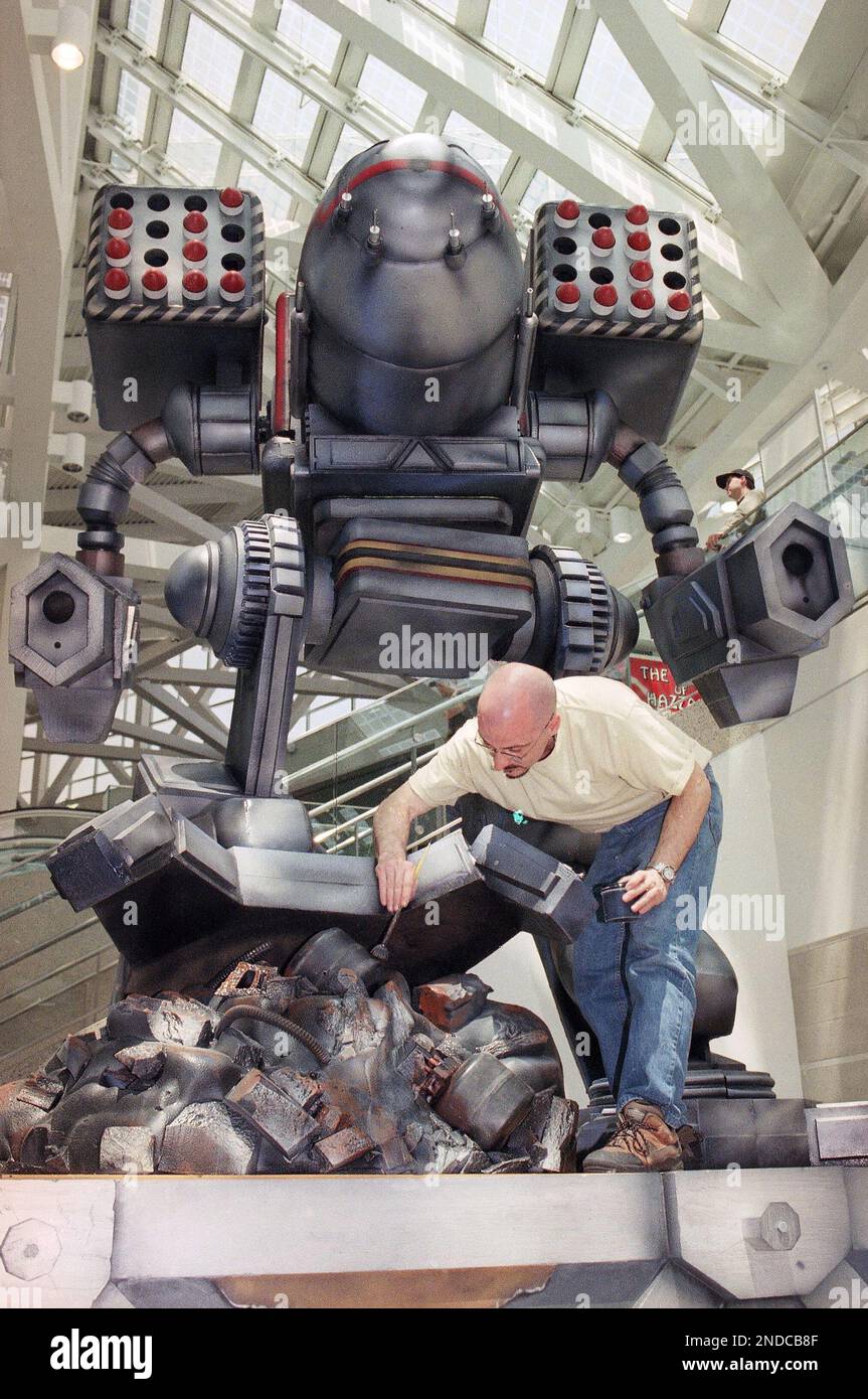 Sculptor Scott Molampy puts the finishing touches on the Mech Warrior ...