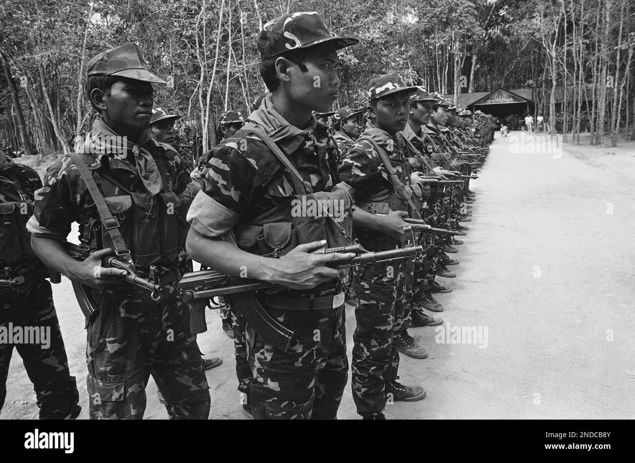 Cambodian guerilla fighters carrying their Chinese-made AK-47 rifles ...