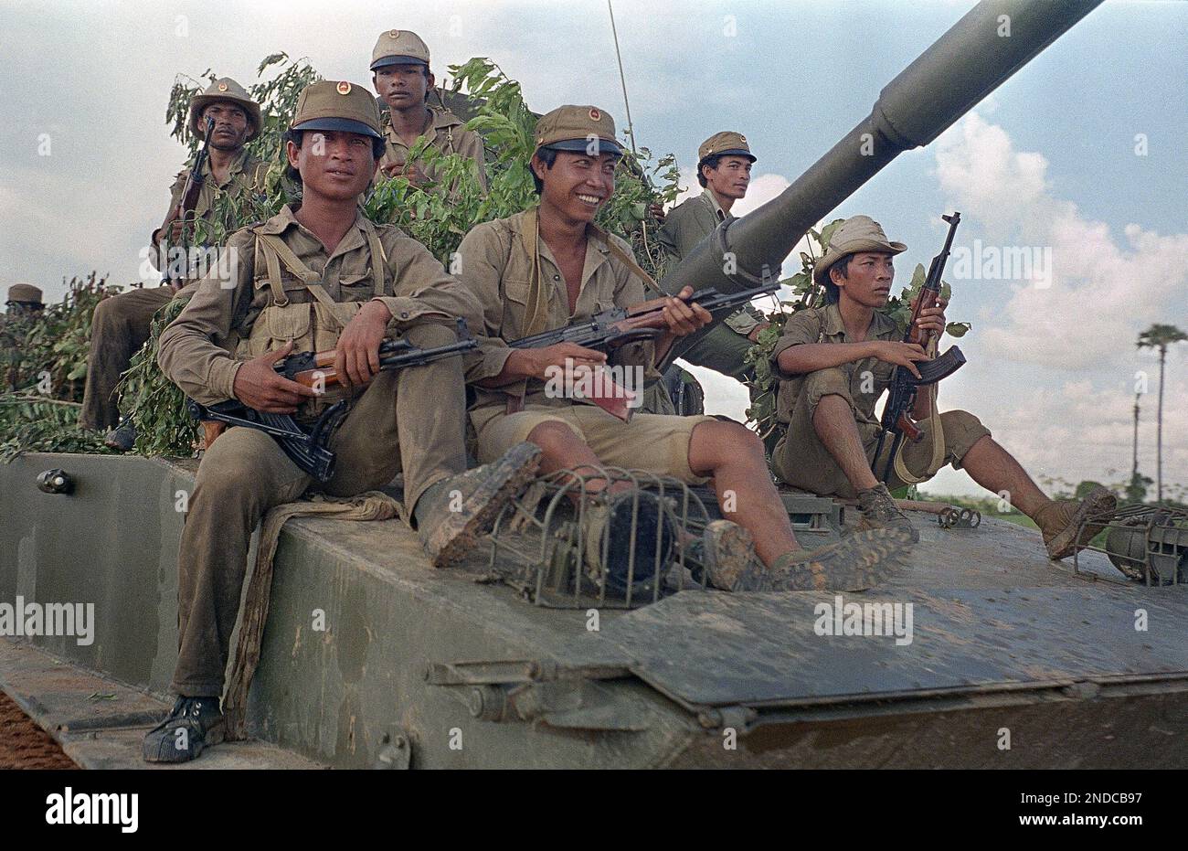 A group of Cambodian infantry men ride atop a Soviet made Vietnamese ...