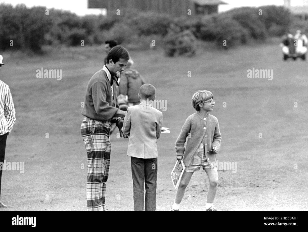 Pat Boone signs autograph as he played in his own Pat Boone Celebrity ...