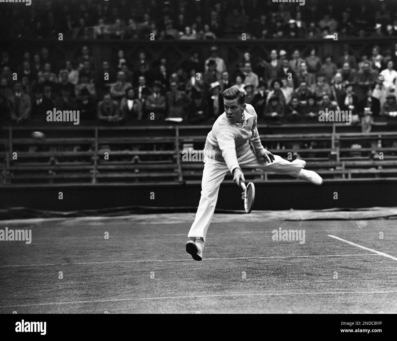 An action shot of American tennis player William Donald McNeill, who ...