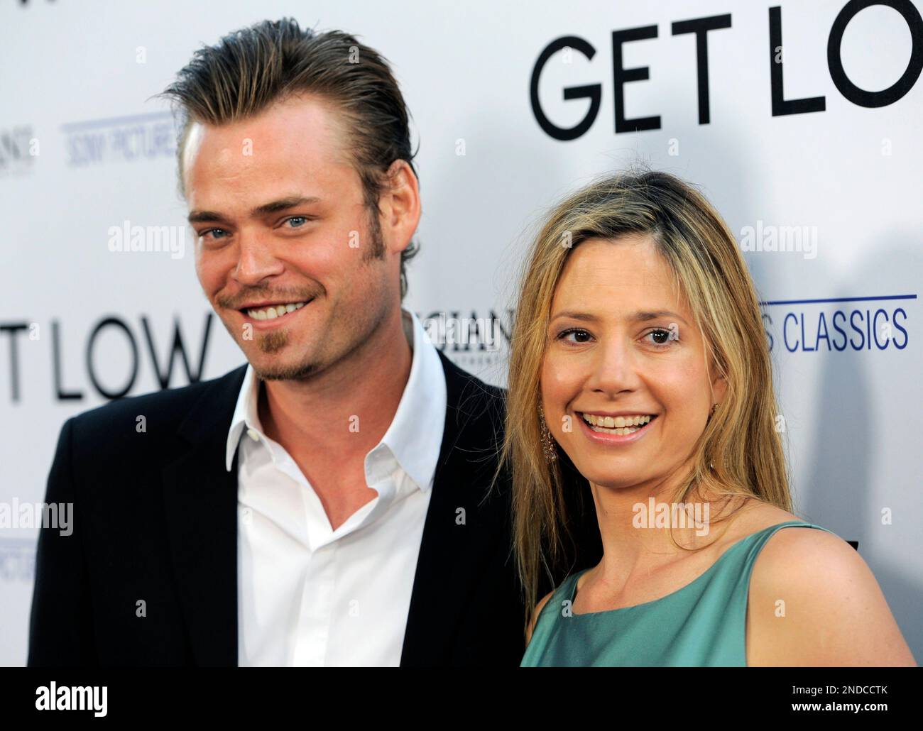 Mira Sorvino, right, and husband Christopher Backus arrive together at ...
