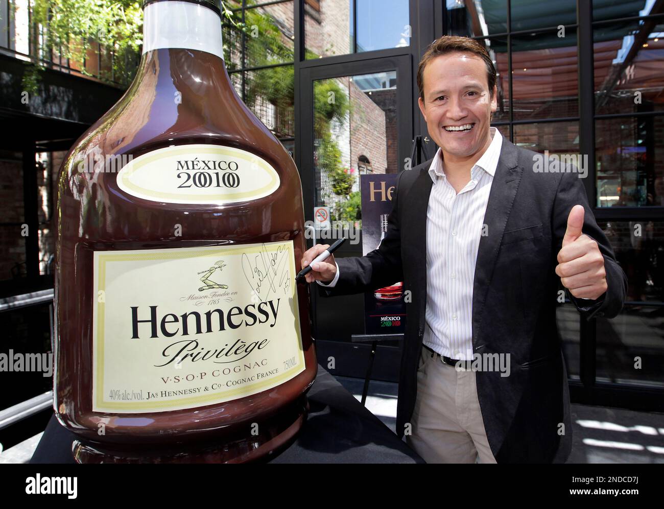 Mexican soccer player Luis Hernandez signs the new Hennessy Mexico 2010 ...