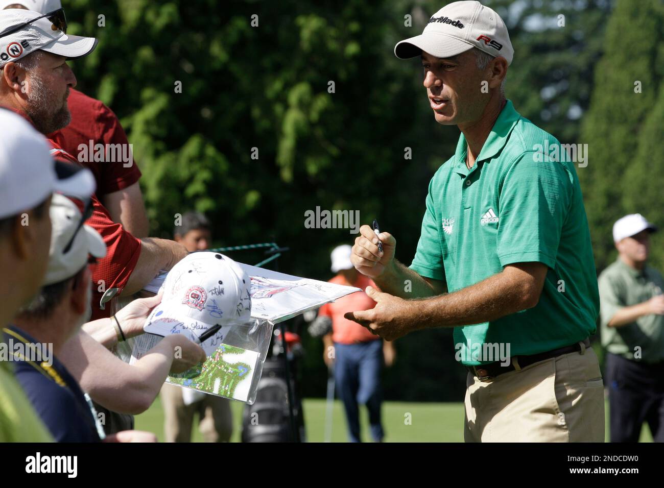 Corey Pavin, captain of the U.S. Ryder Cup team, signs autographs ...