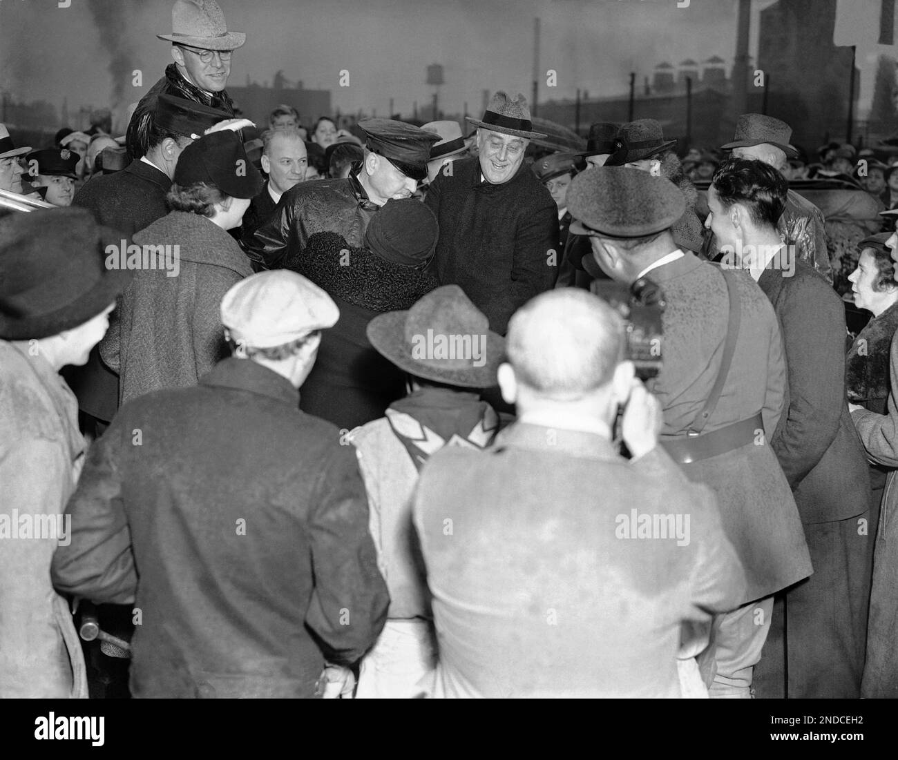 Cheerful despite a chilling rain, President Franklin D. Roosevelt is ...