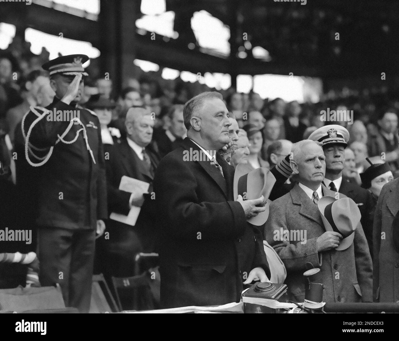 President Franklin D. Roosevelt holds his hat over his heart before the ...