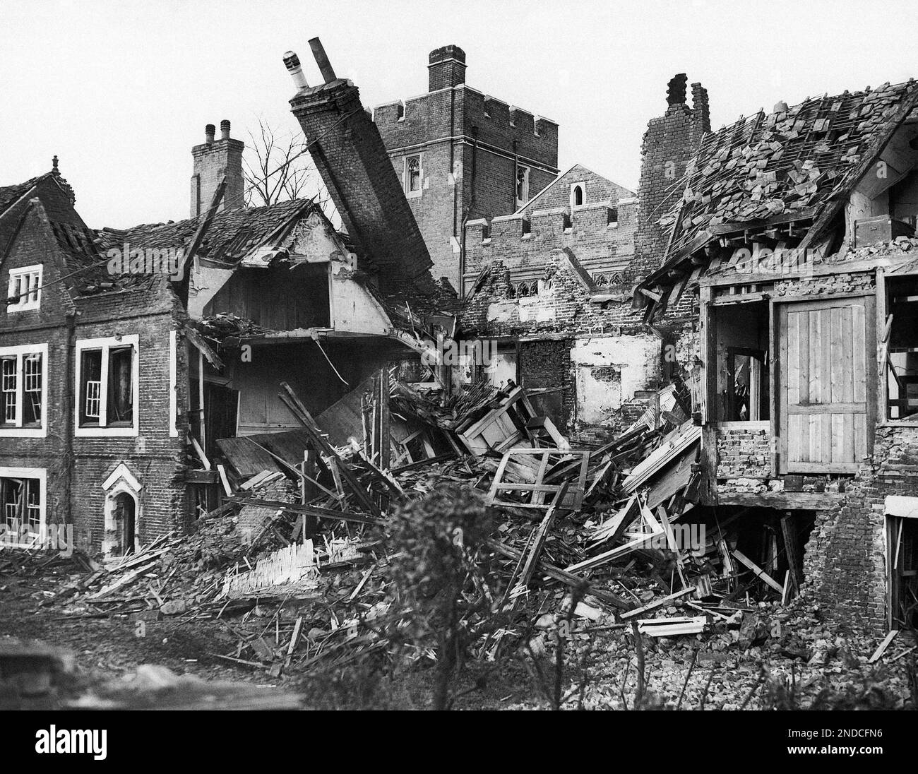 Demolishing an unsafe chimney stack at Saville House, England, Dec. 12 ...